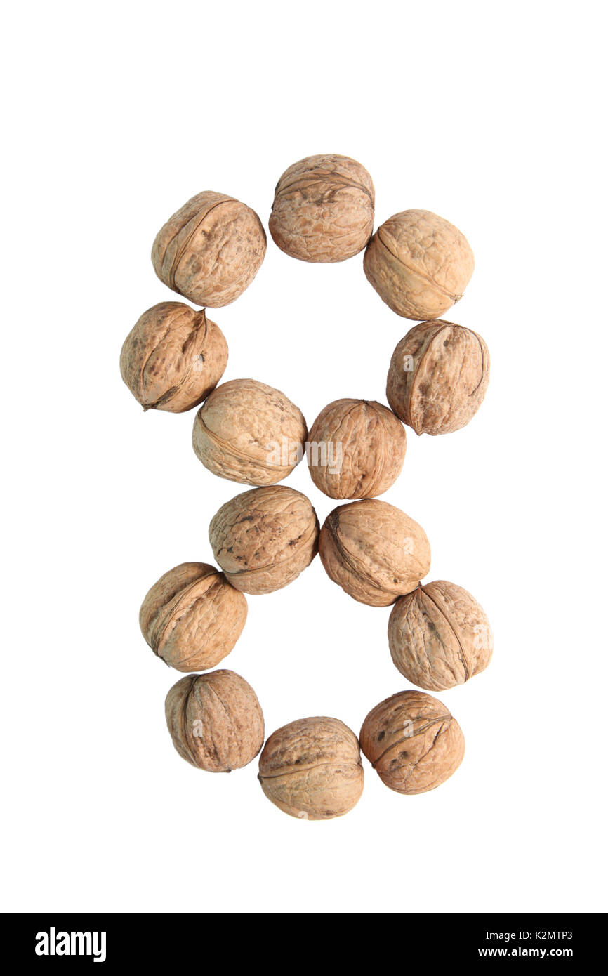 The group of walnuts on white background, making number 8. Studio shot ...