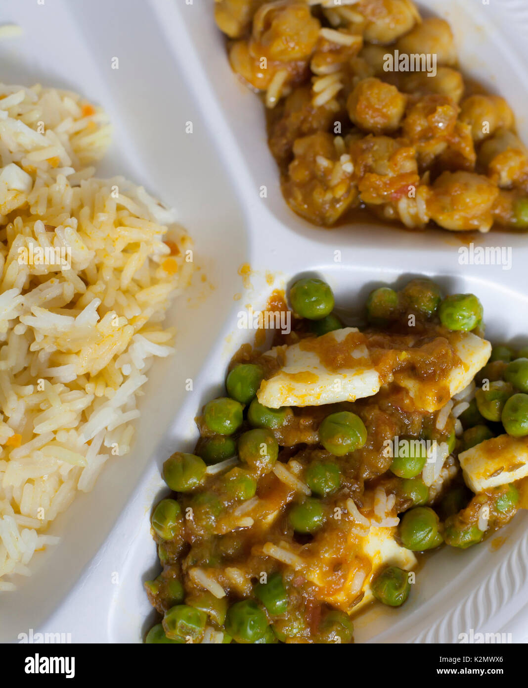 Close up of matar paneer with rice and chickpeas Stock Photo - Alamy