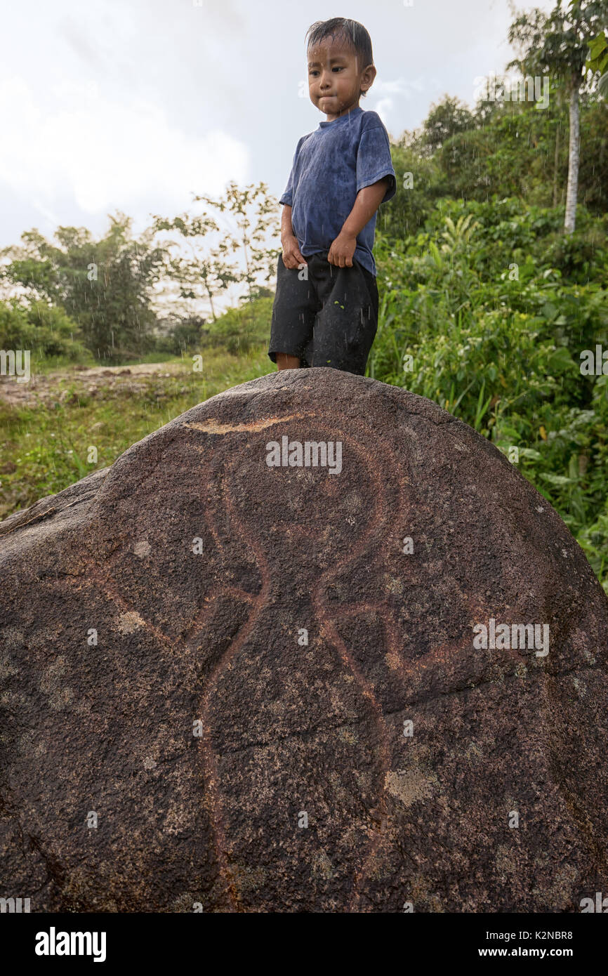 June 1, 2017 Cotundo, Ecuador: a small indigenous boy standing on the ...