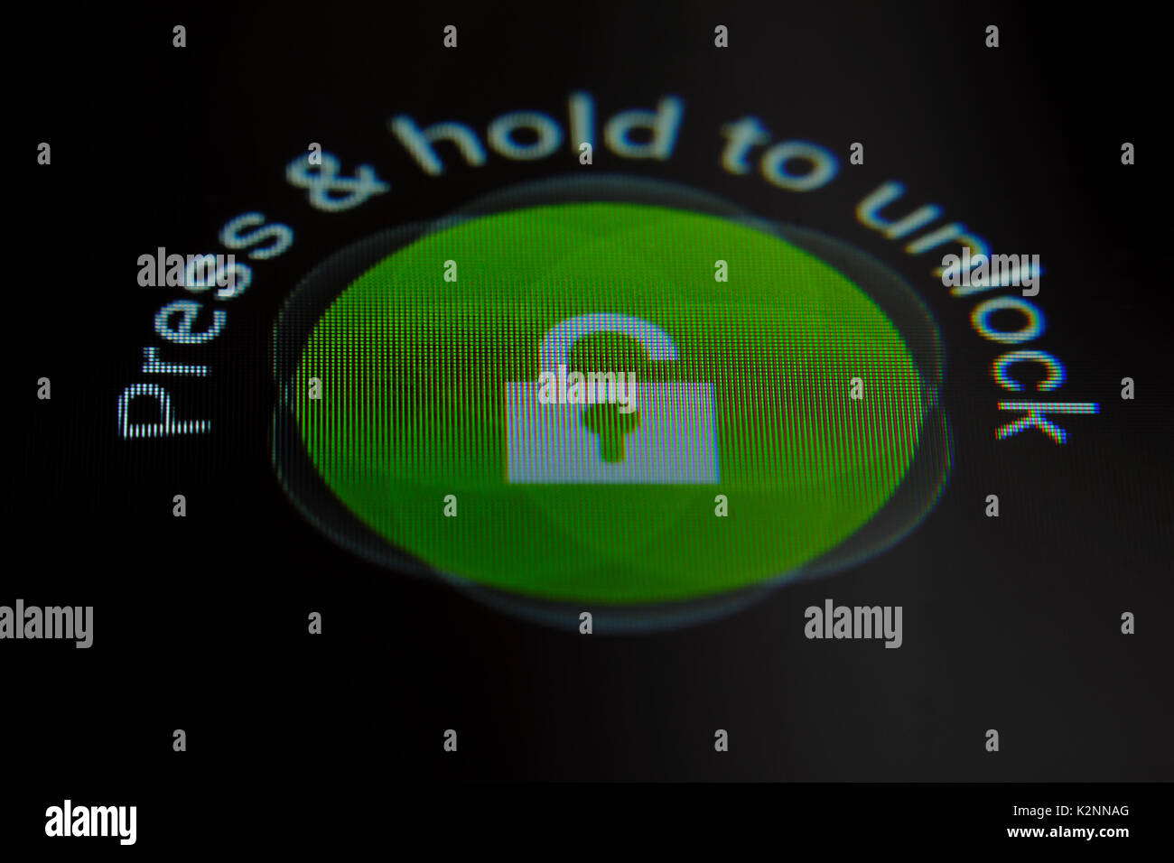 Press & hold to unlock on a smartphone screen Stock Photo - Alamy