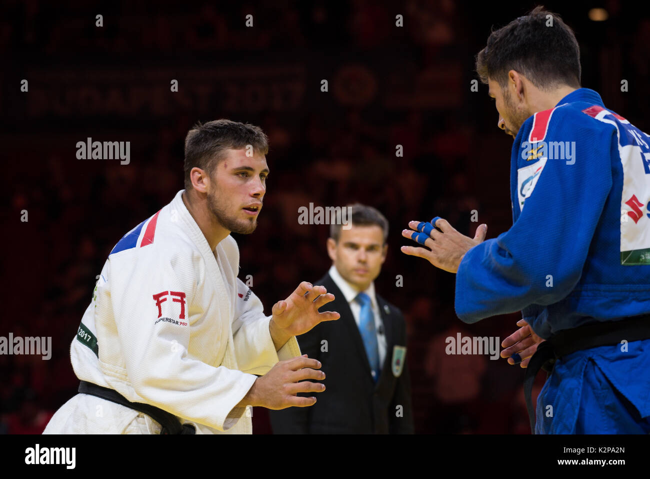 Martin Hojak of Slovenia (white kimono) and Axus Benjamin of France ...