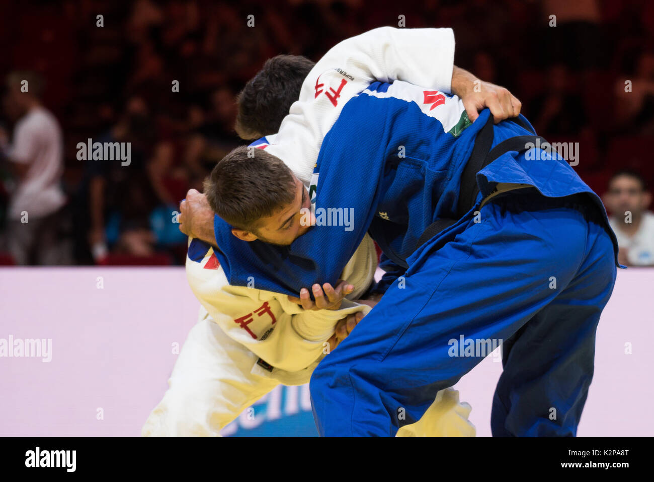 Martin Hojak of Slovenia (white kimono) and Axus Benjamin of France ...