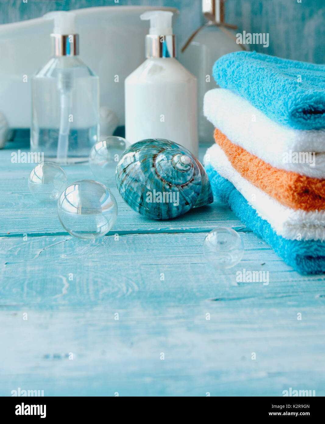 stack of colorful towels on the table, accessories for the bathroom ...