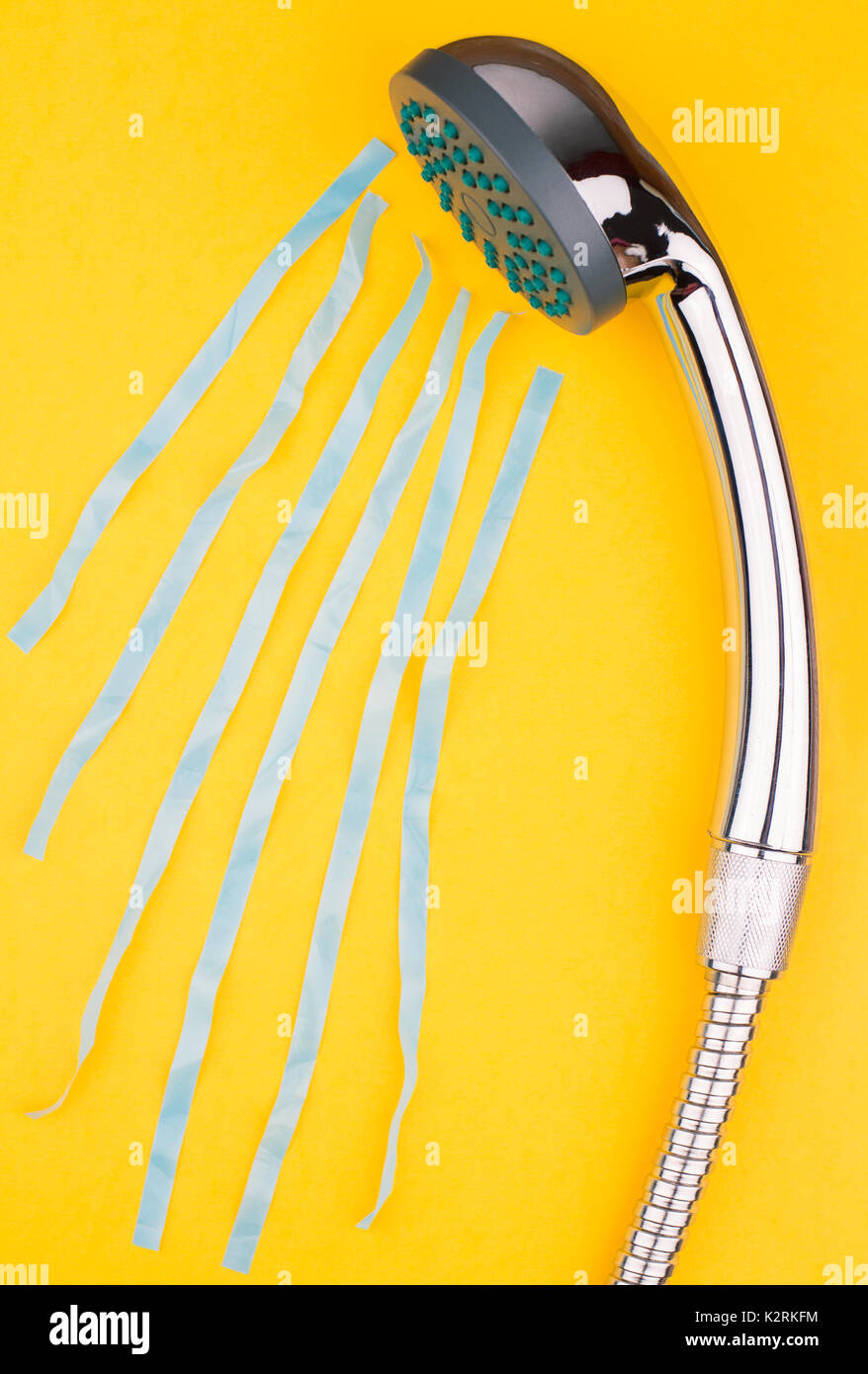 hygiene concept with shower head hose and water made of blue paper on ...