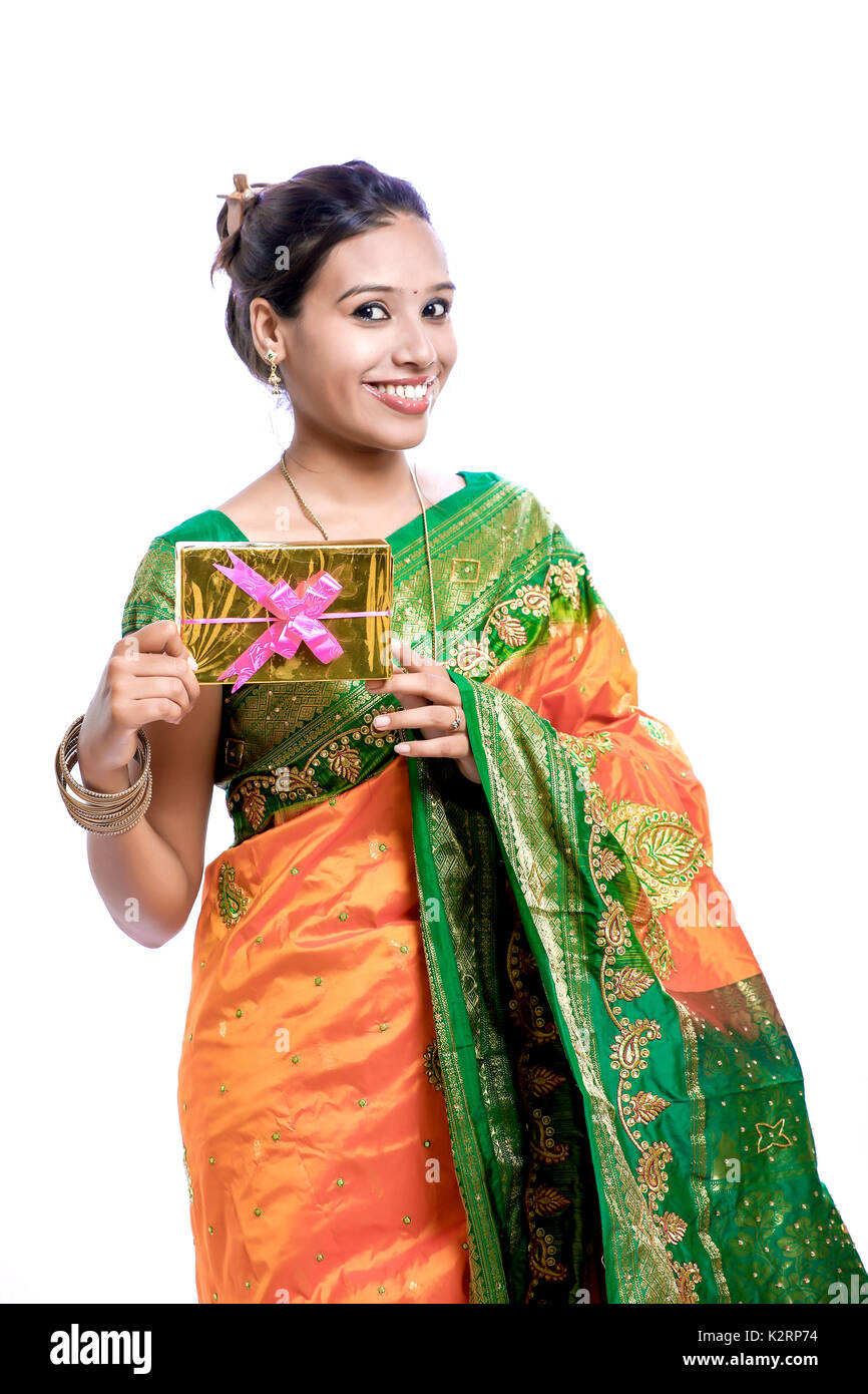 Happy young beautiful Indian woman in traditional saree with gift Stock ...