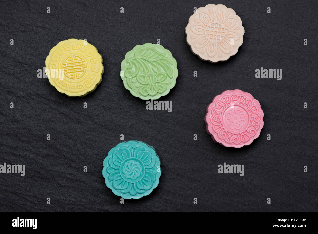 Sweet color of snow skin mooncake on dark background Stock Photo - Alamy