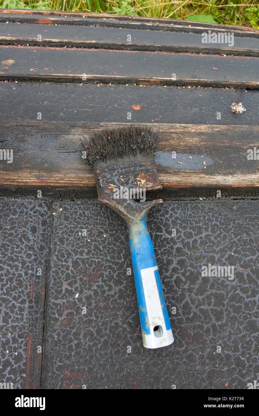 old brush with dried tar on boat Stock Photo - Alamy