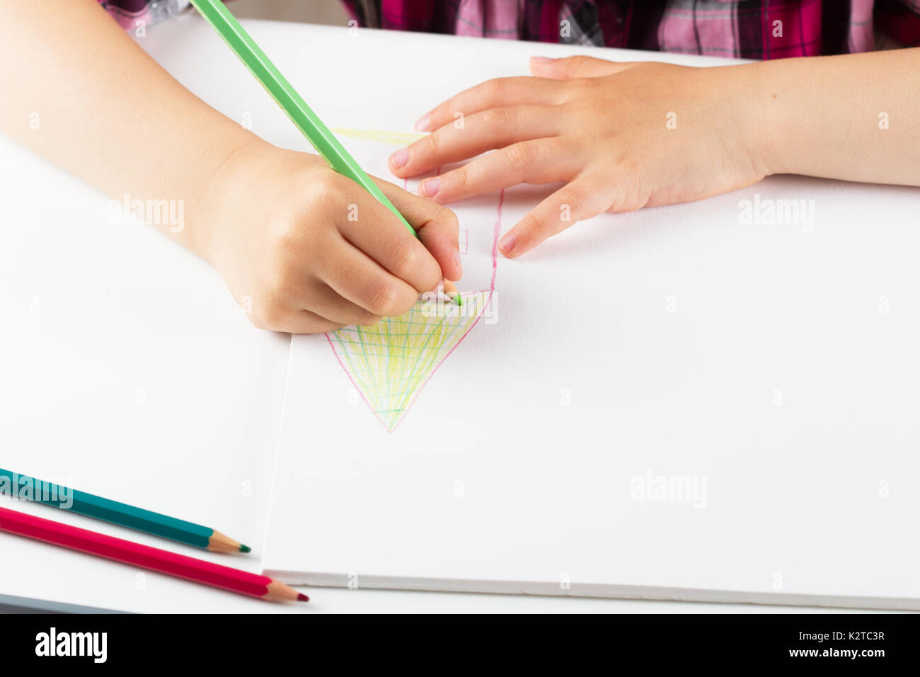 Hand of child drawing by colour pencil Stock Photo - Alamy