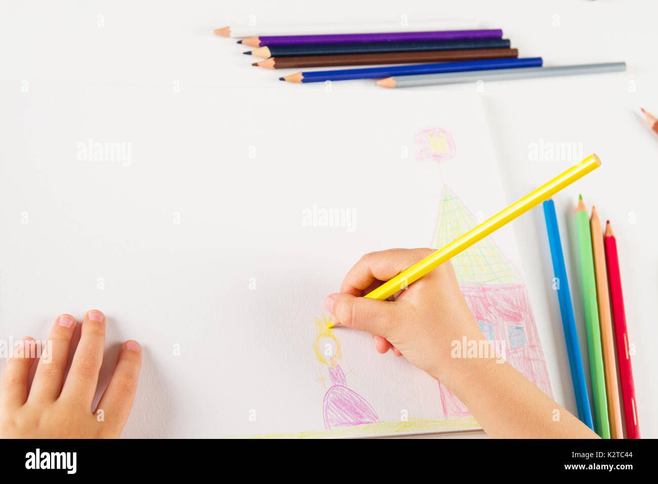 Hand of child drawing by colour pencil Stock Photo - Alamy