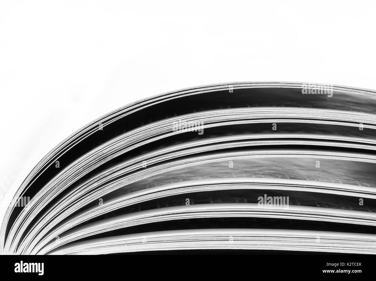 the pages of an open book lit by daylight, macro. black and white photo ...