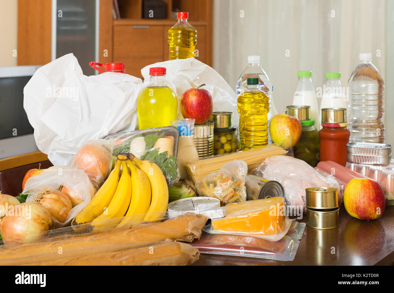 foodstuffs of supermarket on table in home Stock Photo - Alamy