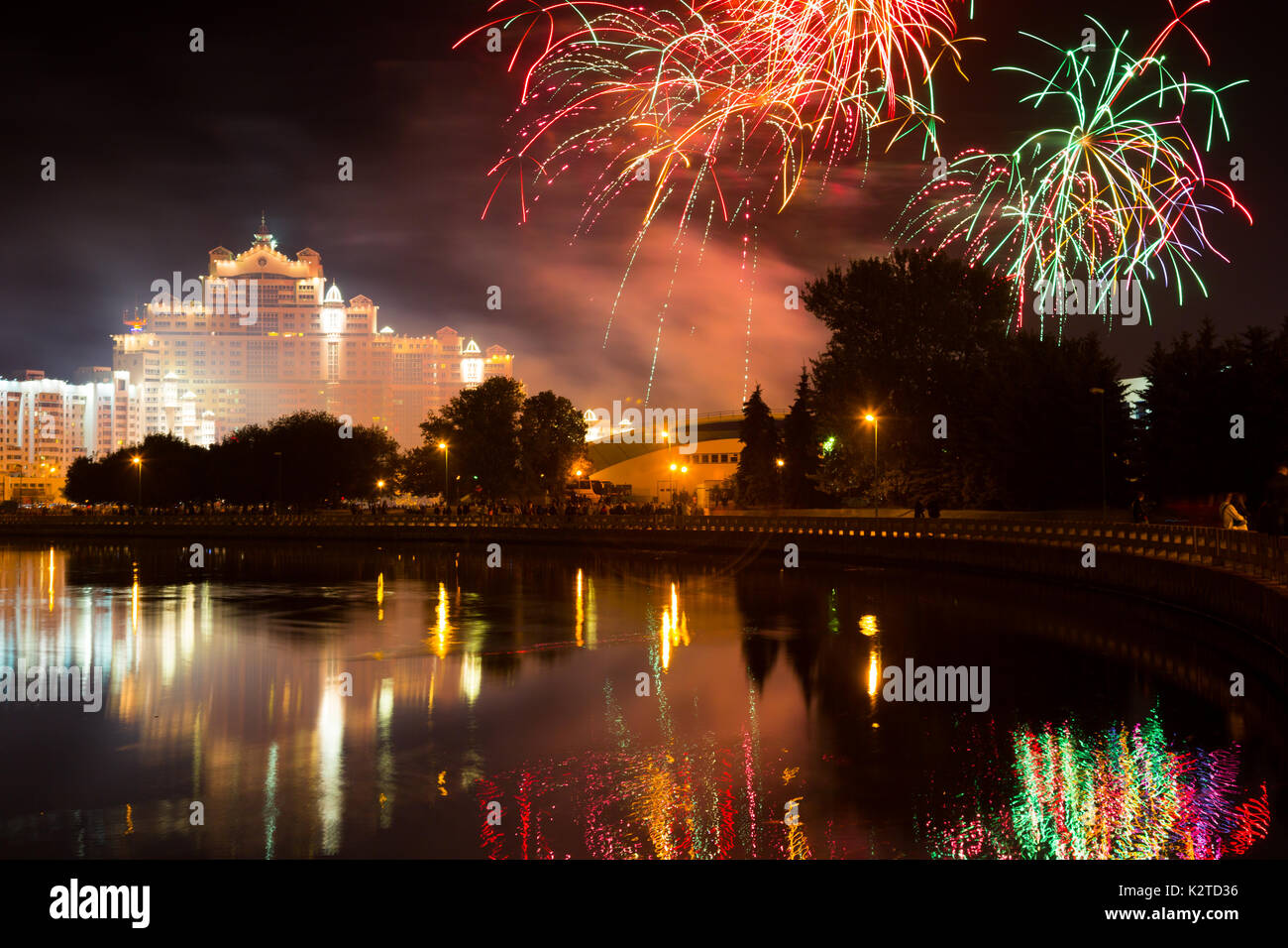 pyrotechnical show with fireworks in night sky on waterfront in minsk ...