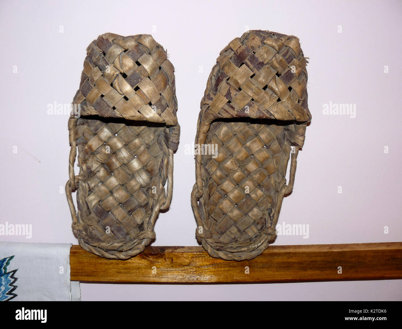 Wicker shoes bast shoes. Bast shoes on a stand Stock Photo - Alamy