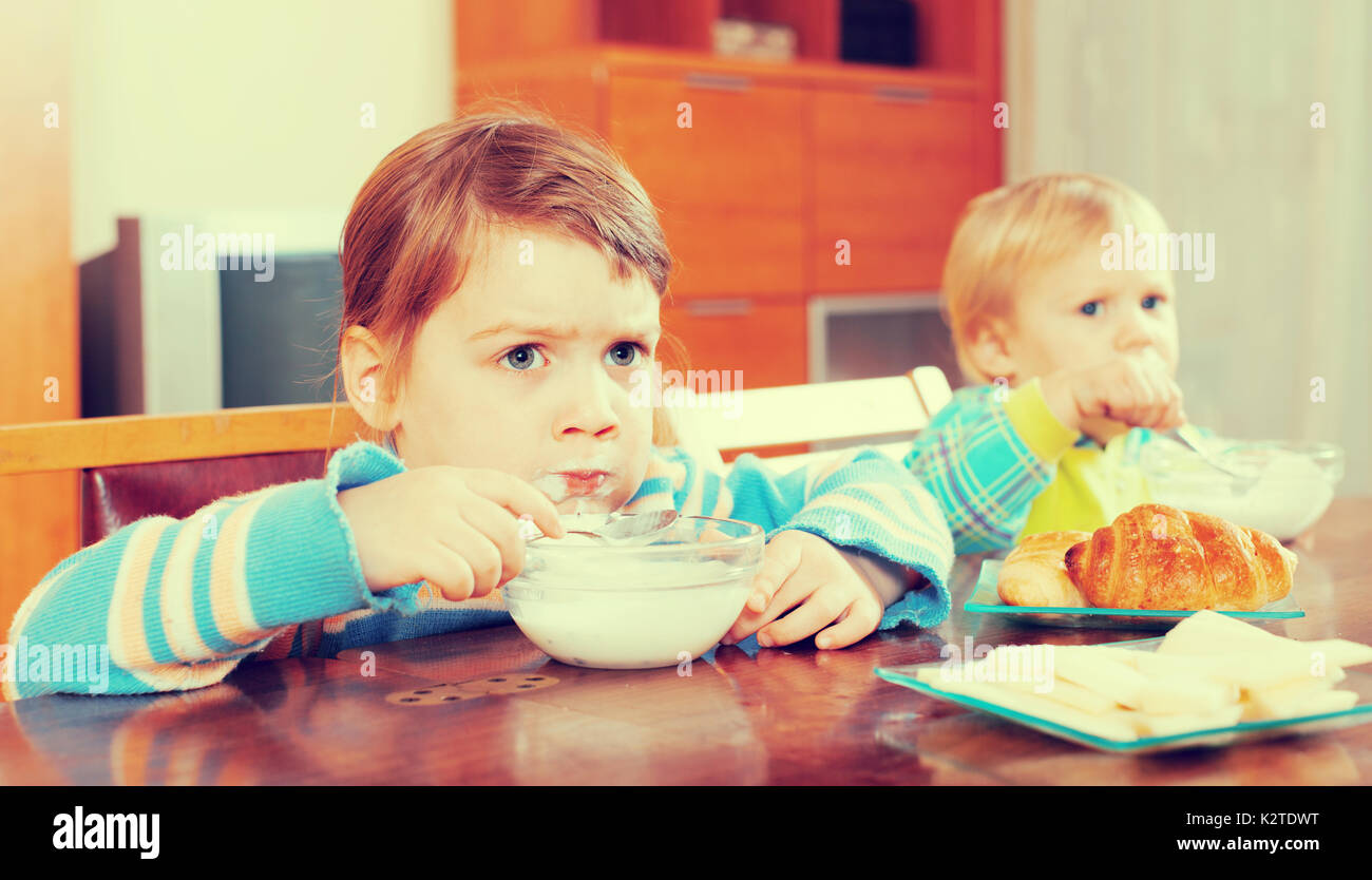 siblings eating dairy breakfast together Stock Photo - Alamy