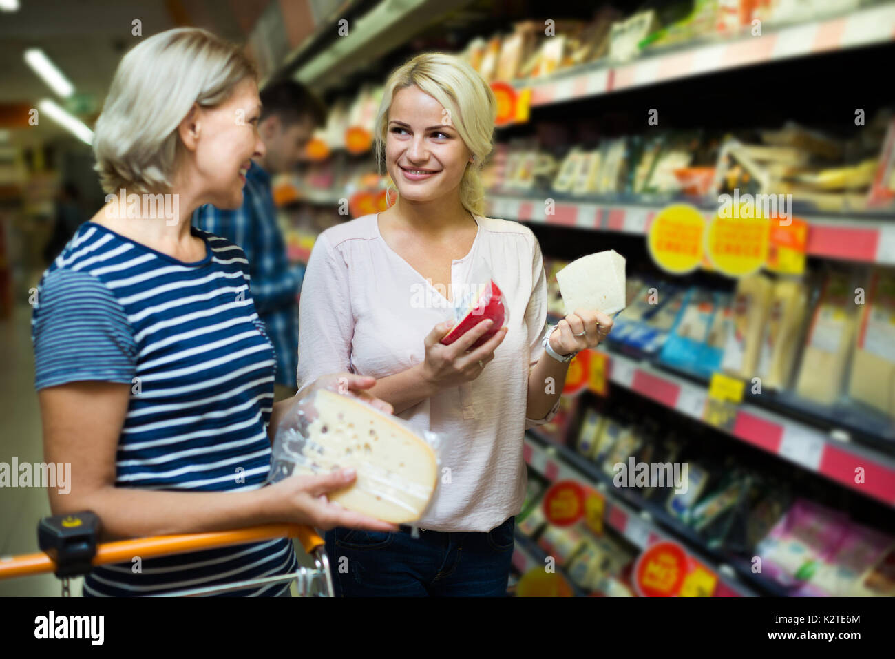 family purchasing food in interior Stock Photo - Alamy