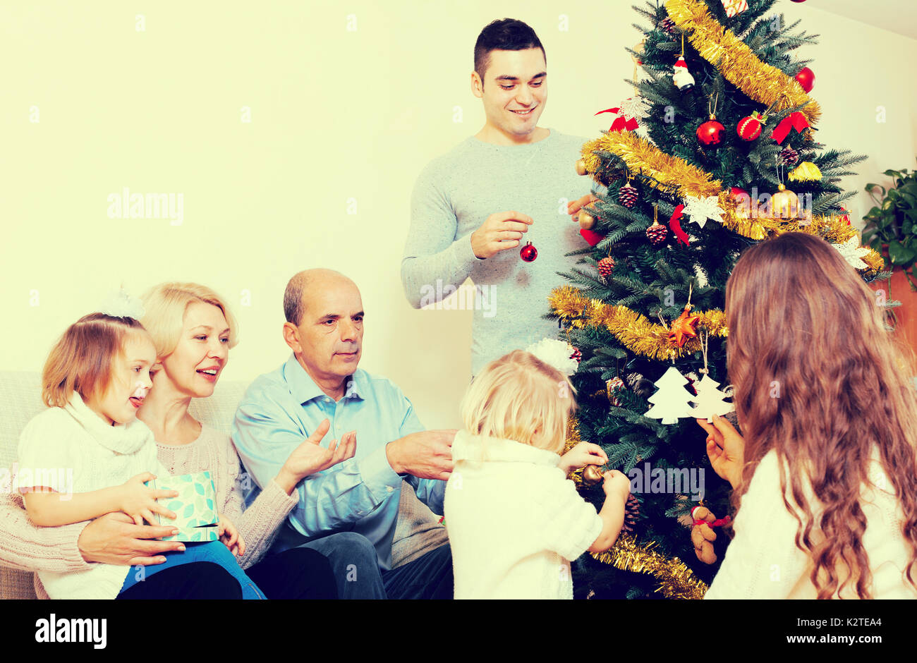 big happy family with decorated Christmas tree Stock Photo - Alamy