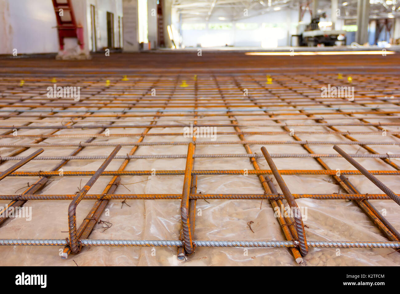 the reinforcing grid fastened with a wire from a channeled steel rod ...