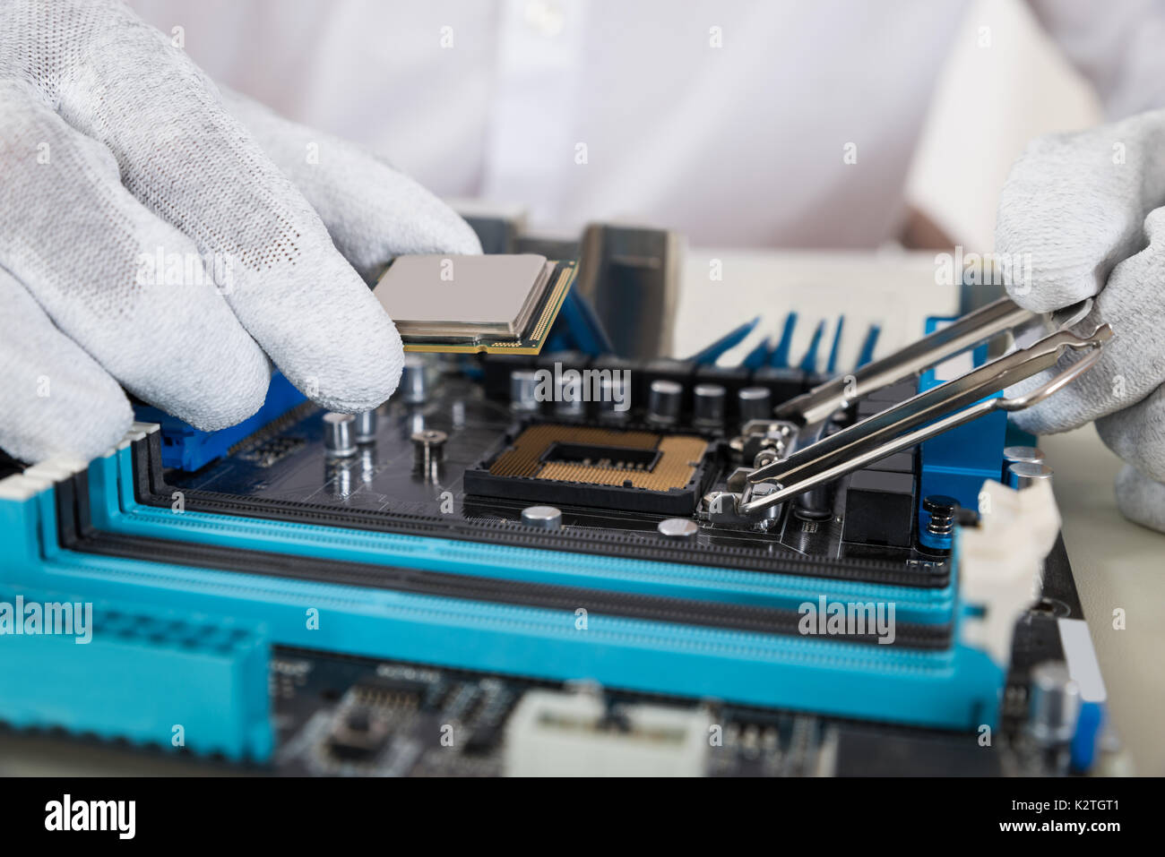 Close-up Of Person Hands Installing Central Processor In Motherboard Stock Photo - Alamy