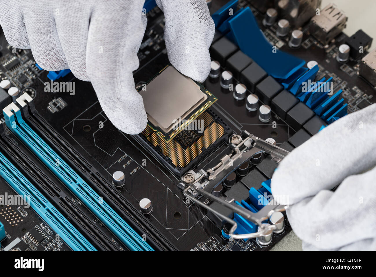 Close-up Of Person Hands Installing Central Processor In Motherboard Stock Photo - Alamy