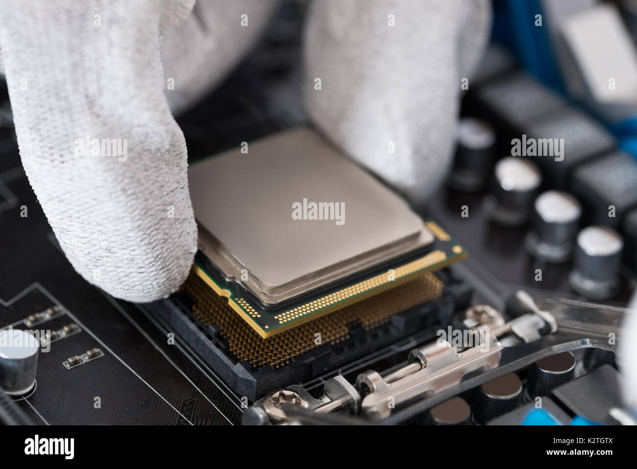 Close-up Of Person Hands Installing Central Processor In Motherboard Stock Photo - Alamy