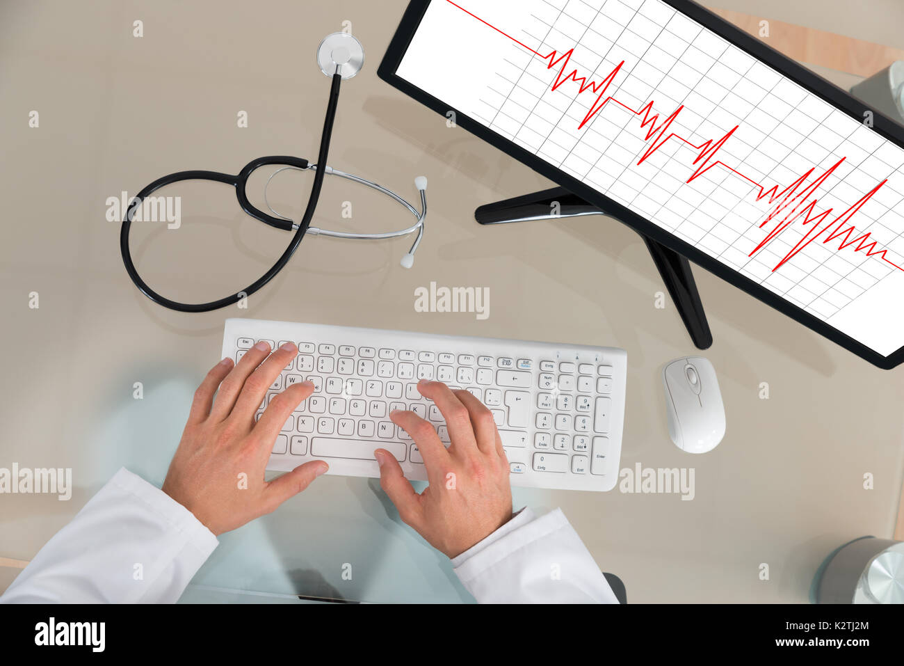 Male medic working computer hi-res stock photography and images - Alamy