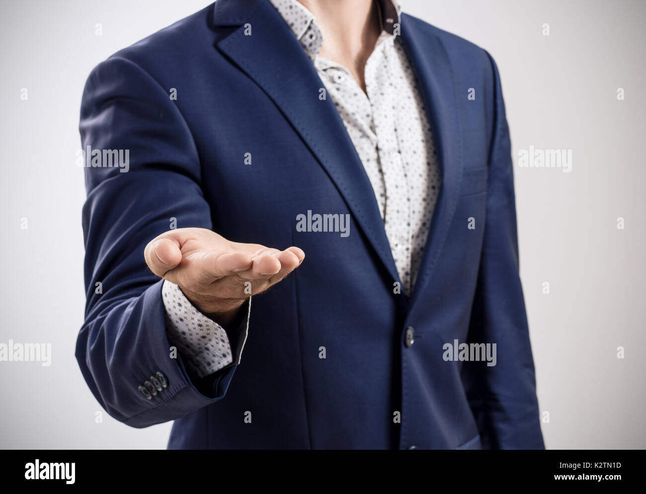 Man shows outstretched hand with open palm Stock Photo - Alamy