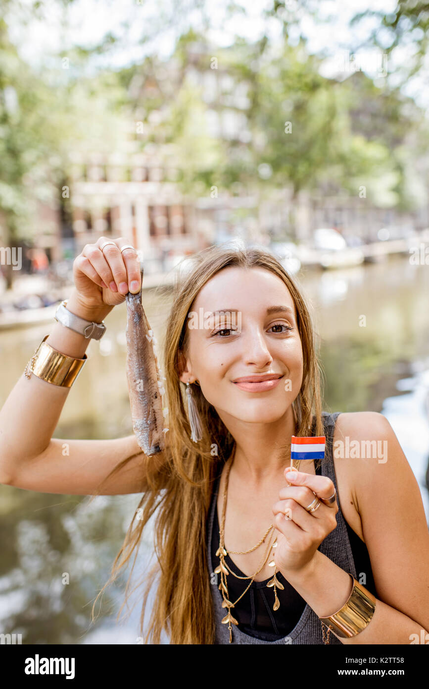 Woman with harring in Amsterdam Stock Photo - Alamy