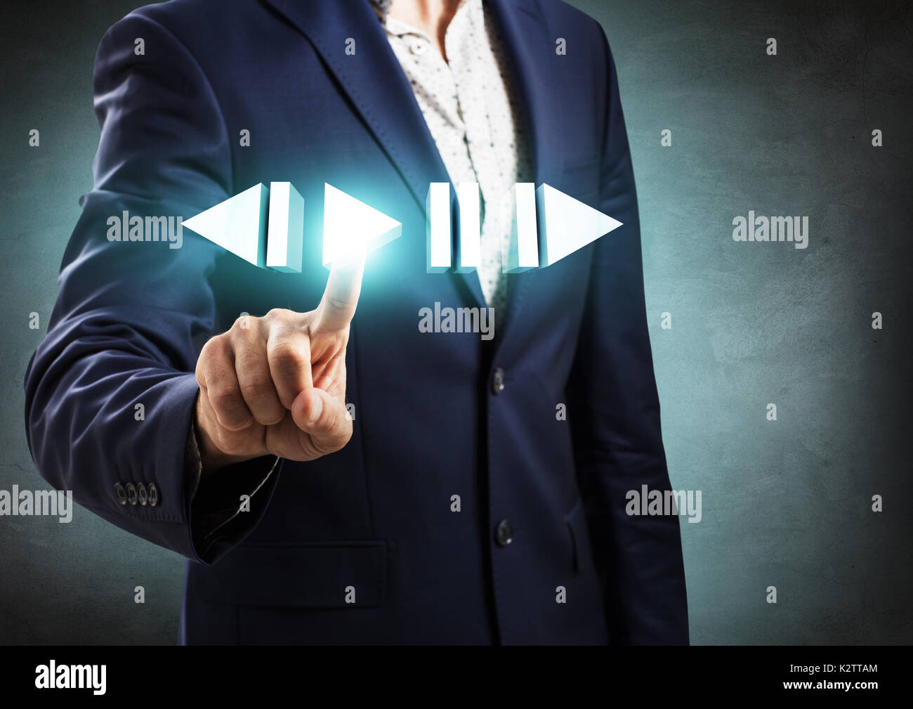 Businessman pressing simple virtual play button Stock Photo - Alamy