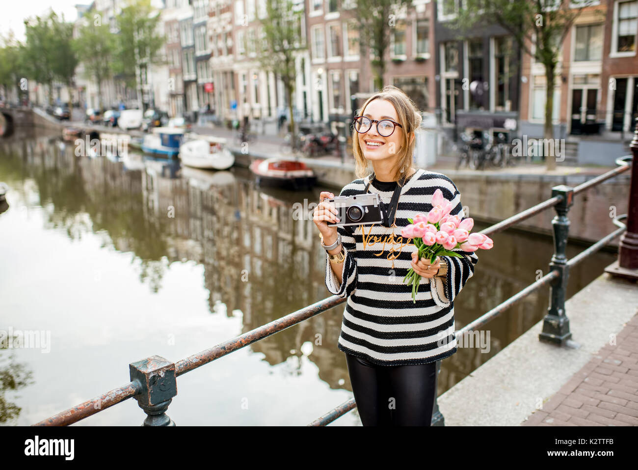 Woman traveling in Amsterdam city Stock Photo - Alamy