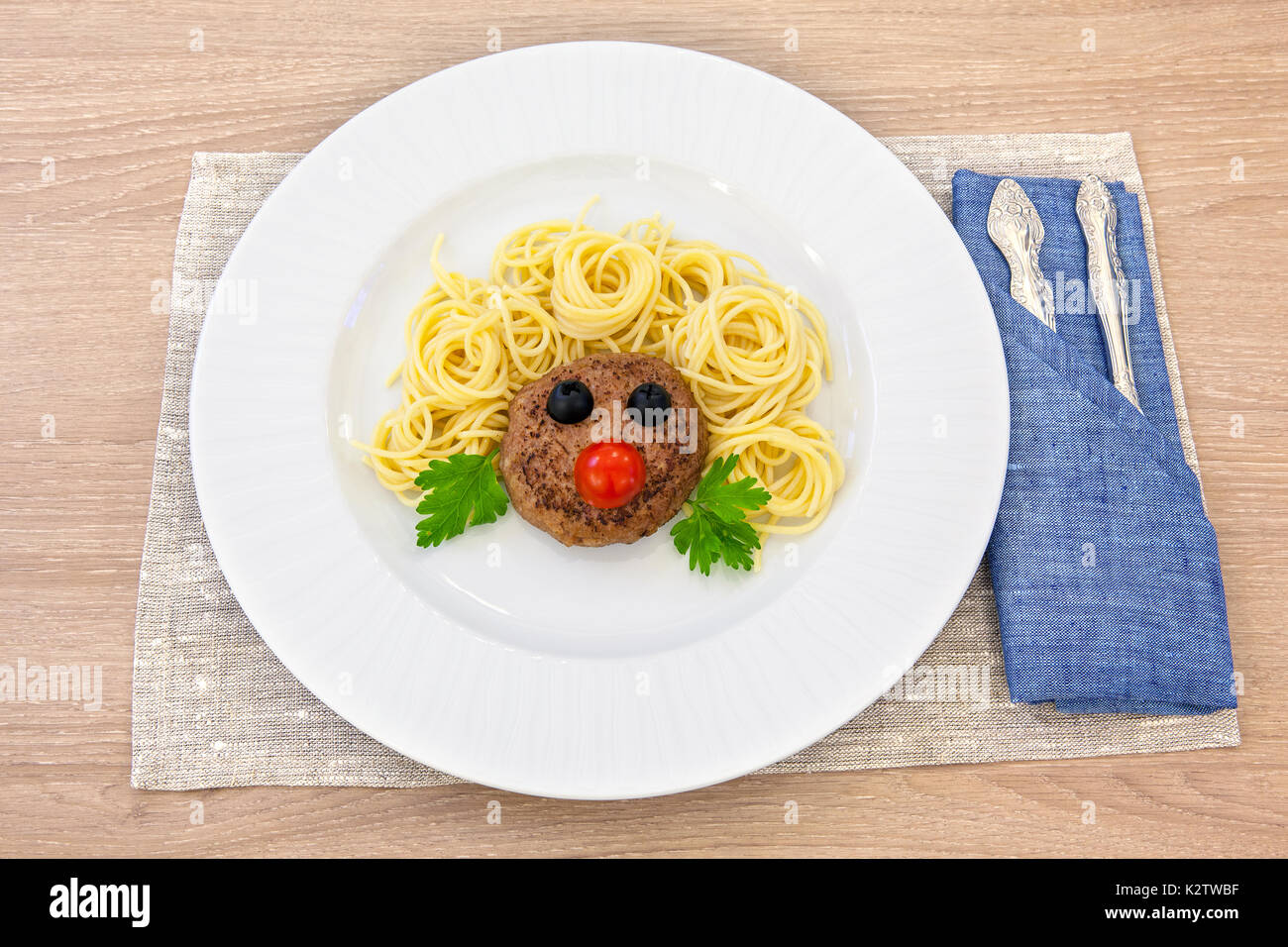 white plate with spaghetti and meat Patty cooked for children Stock ...