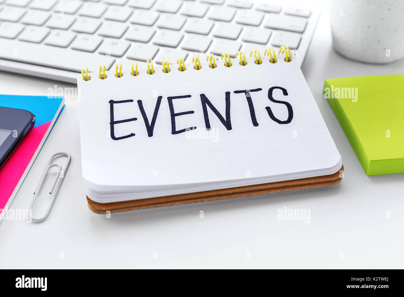 Events word on notebook with computer keyboard for event planning ...