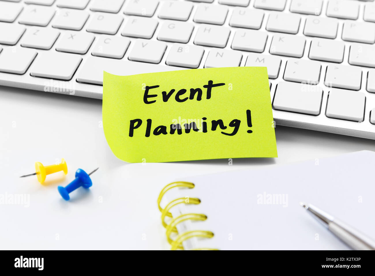 Event planning word on notepad with pin on white office desk Stock ...