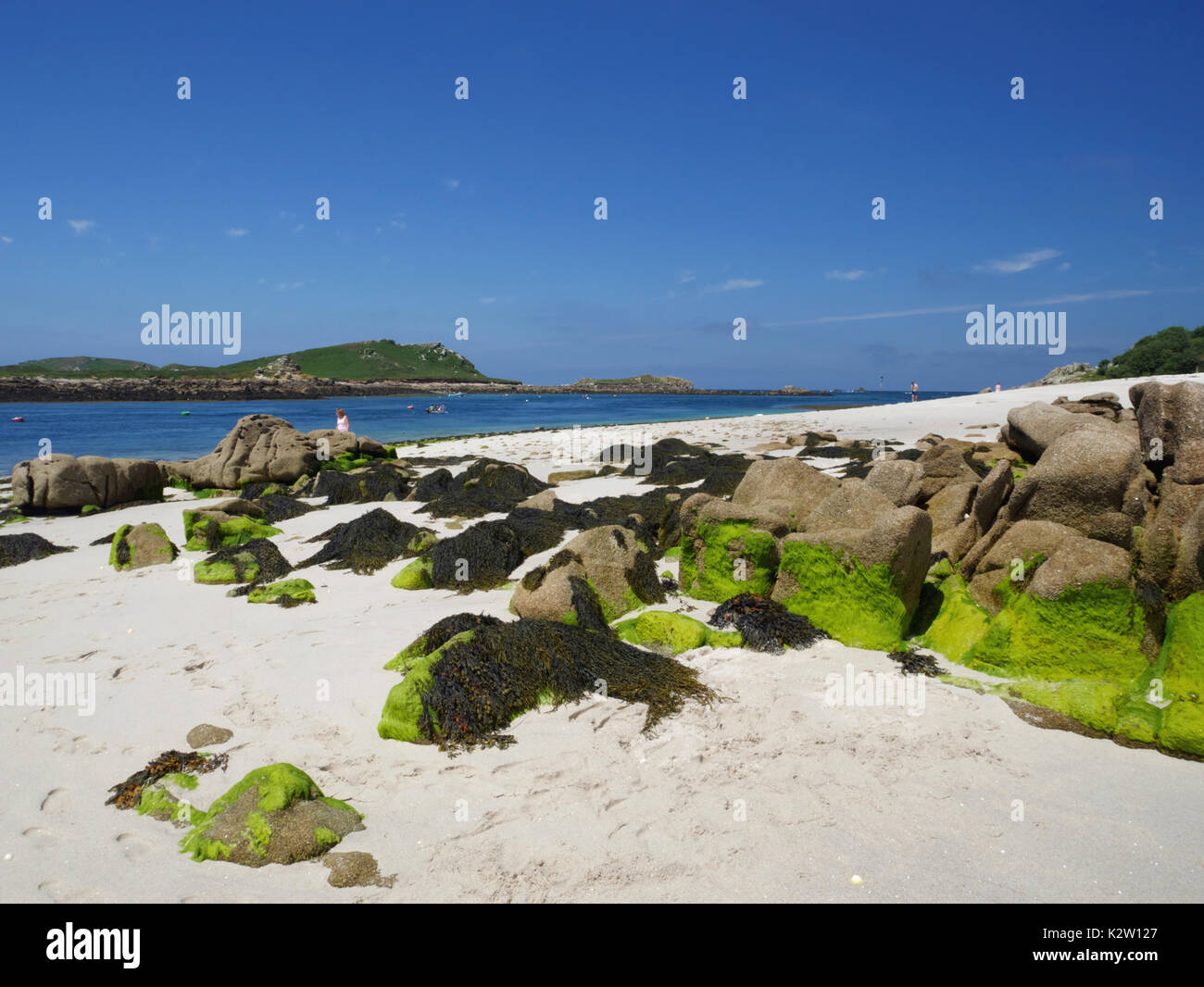The island of Tean seen from the white sandy beach on St Martin's ...