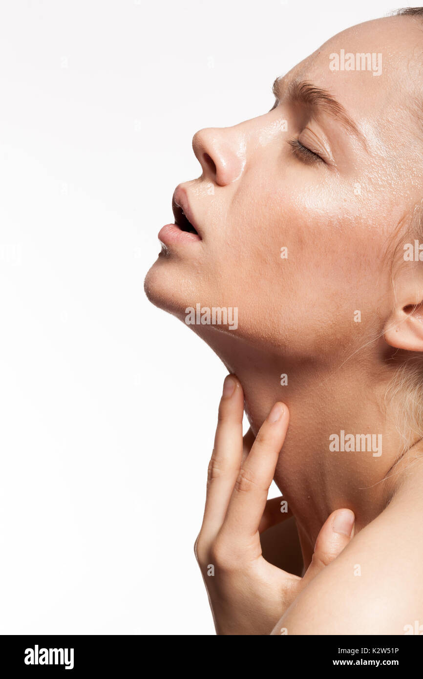 Gorgeous beautiful woman with wet face. Studio photo. Beauty and skin ...