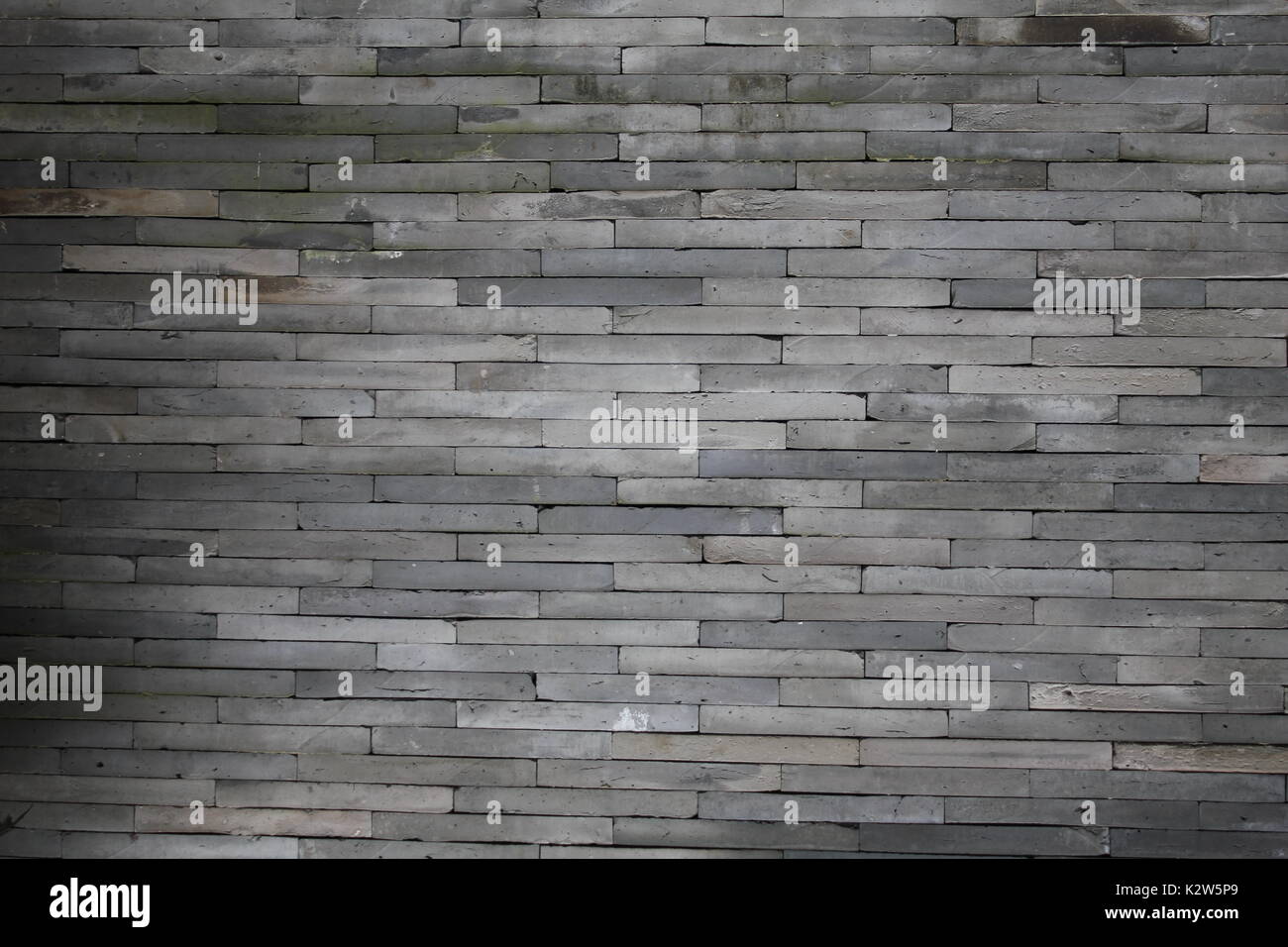 An Asian style slate-brick wall Stock Photo - Alamy