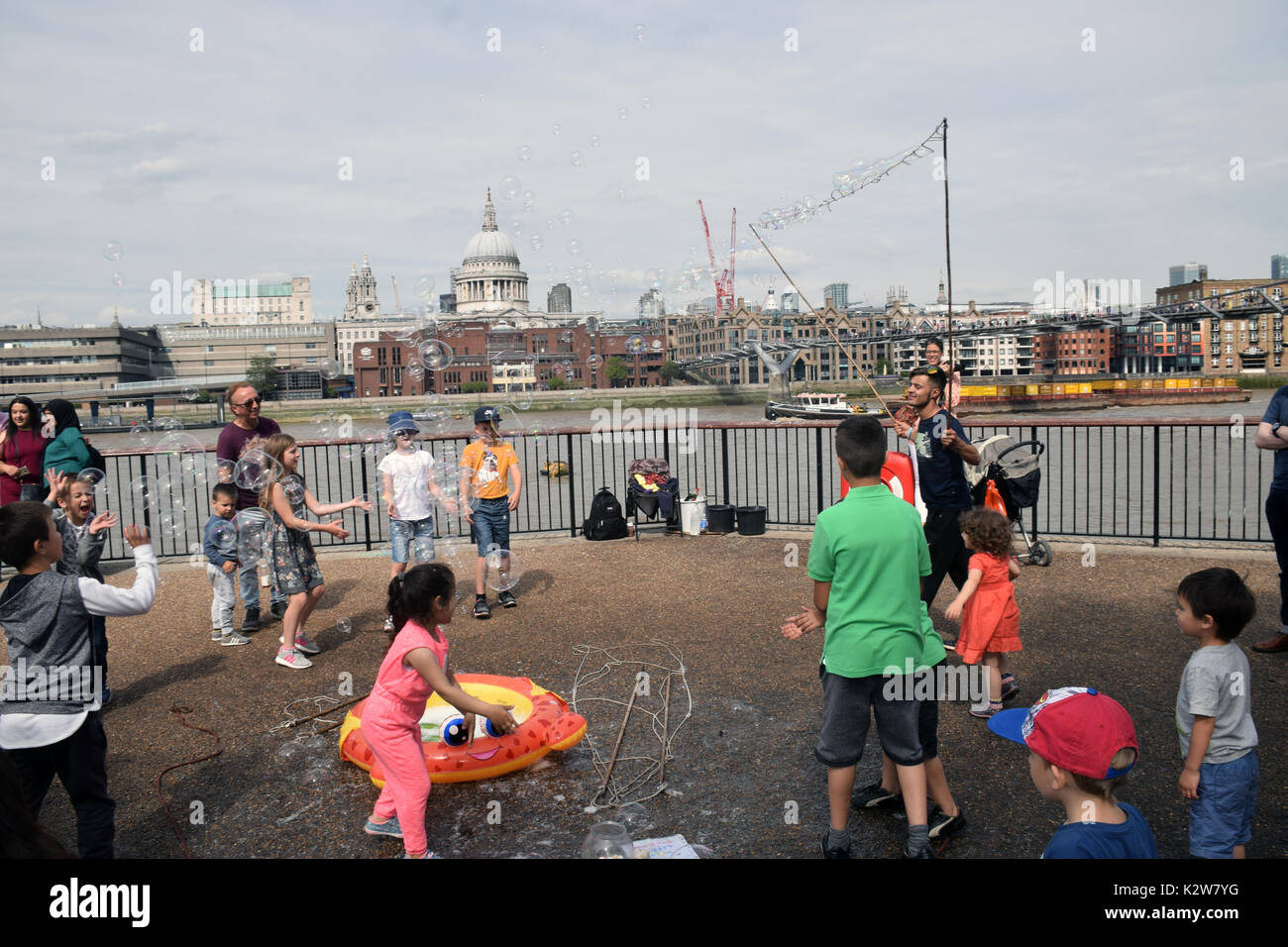 Bubbles entertainer, South Bank, London UK Stock Photo - Alamy