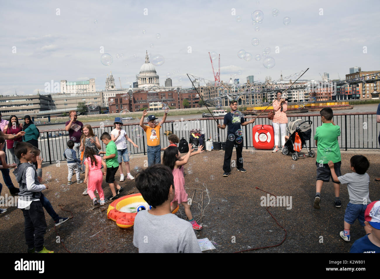 Bubbles entertainer, South Bank, London UK Stock Photo - Alamy