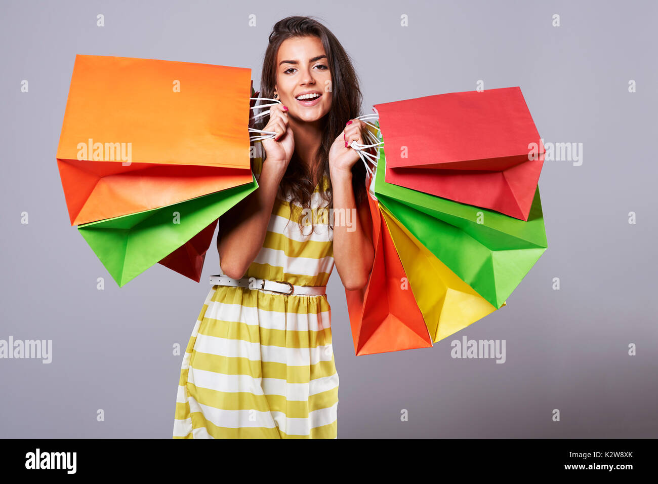 Positive emotions of woman with colorful shopping bags Stock Photo - Alamy