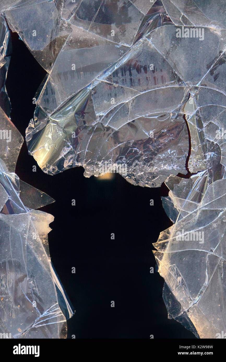 background broken window during riots. glass pieces hole mayhem Stock ...