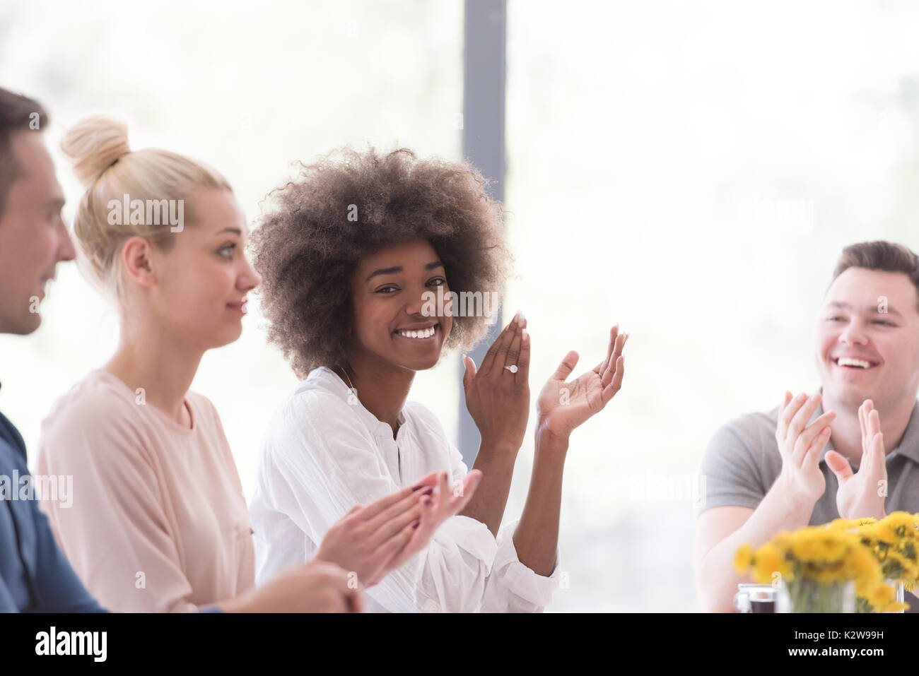 multiethnic Group of young business people looking happy while ...