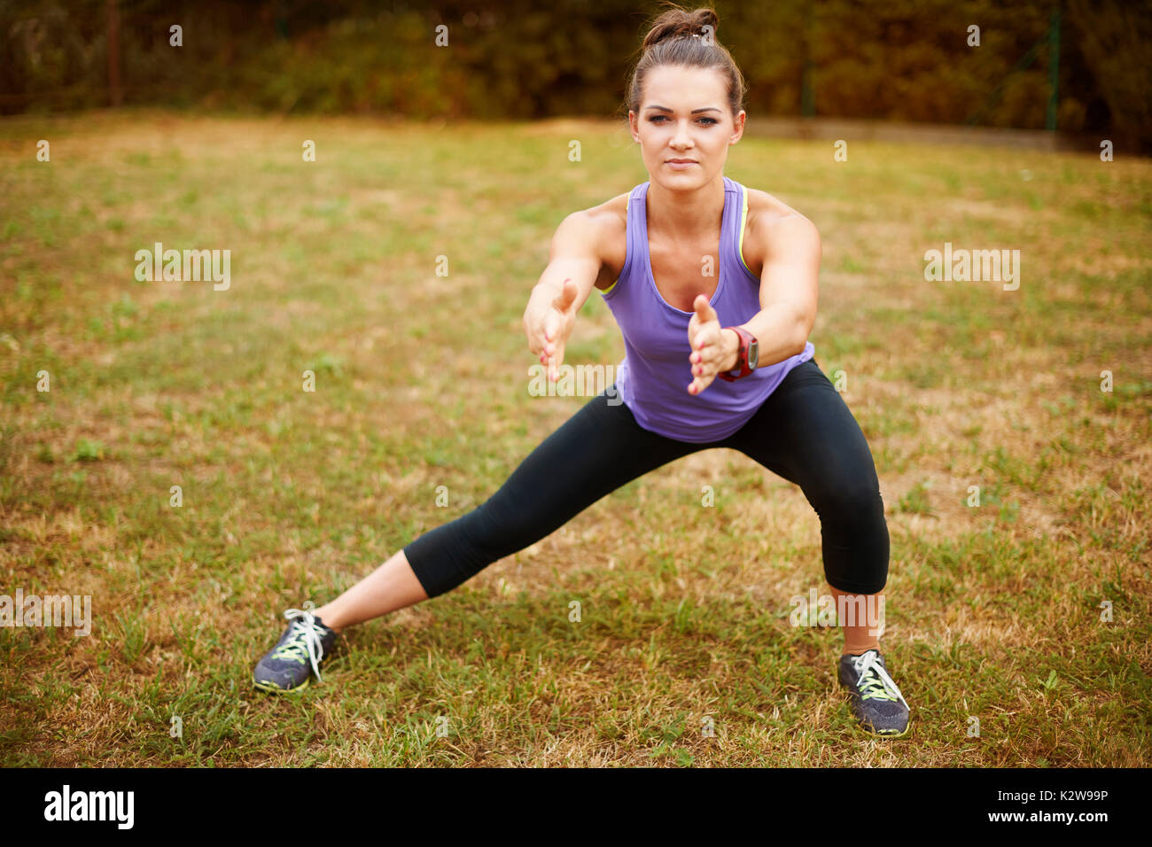 Fit brunette woman exercising hi-res stock photography and images - Alamy