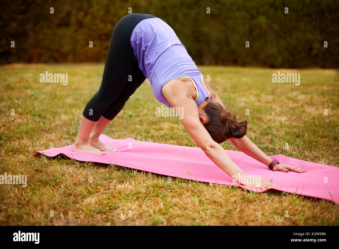 This stretched woman is in a good shape Stock Photo - Alamy