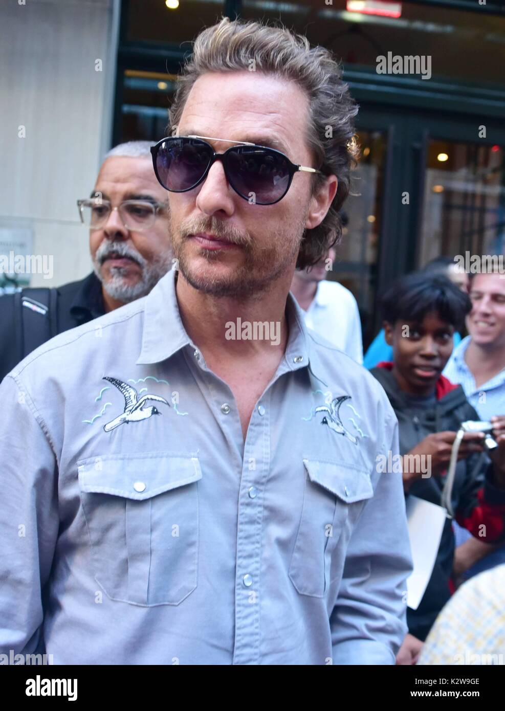 Matthew McConaughey signs autographs for fans as he leaves a Dark Tower ...