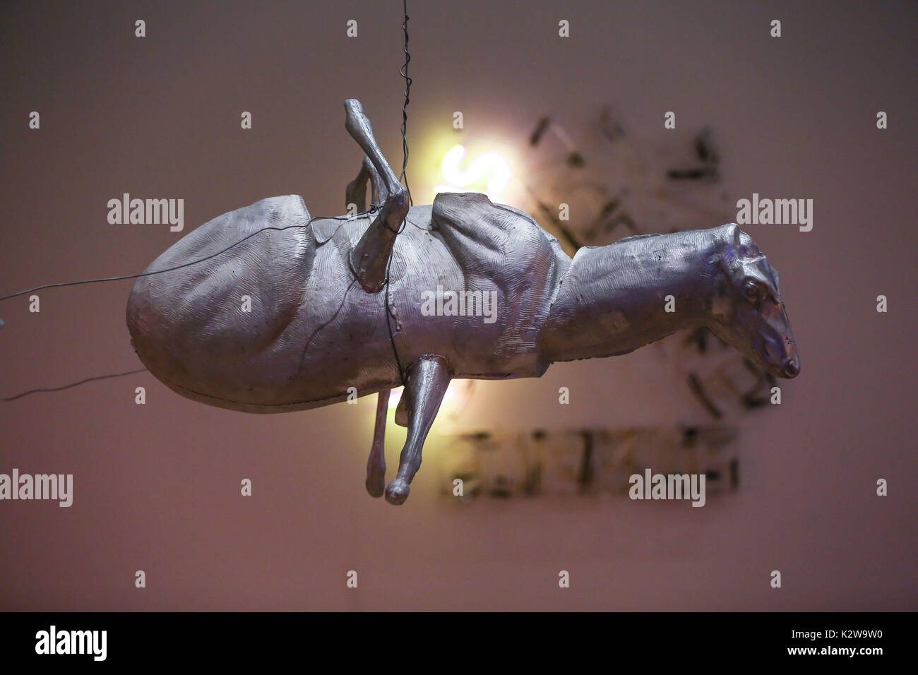 Bright neon sculptures including Violins Violence Silence and Run from ...