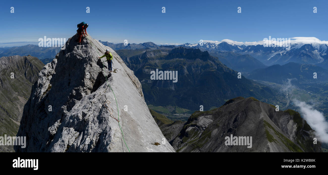 Climbers on the Arete du Doigt on Pointe Percee in the Aravis Stock ...