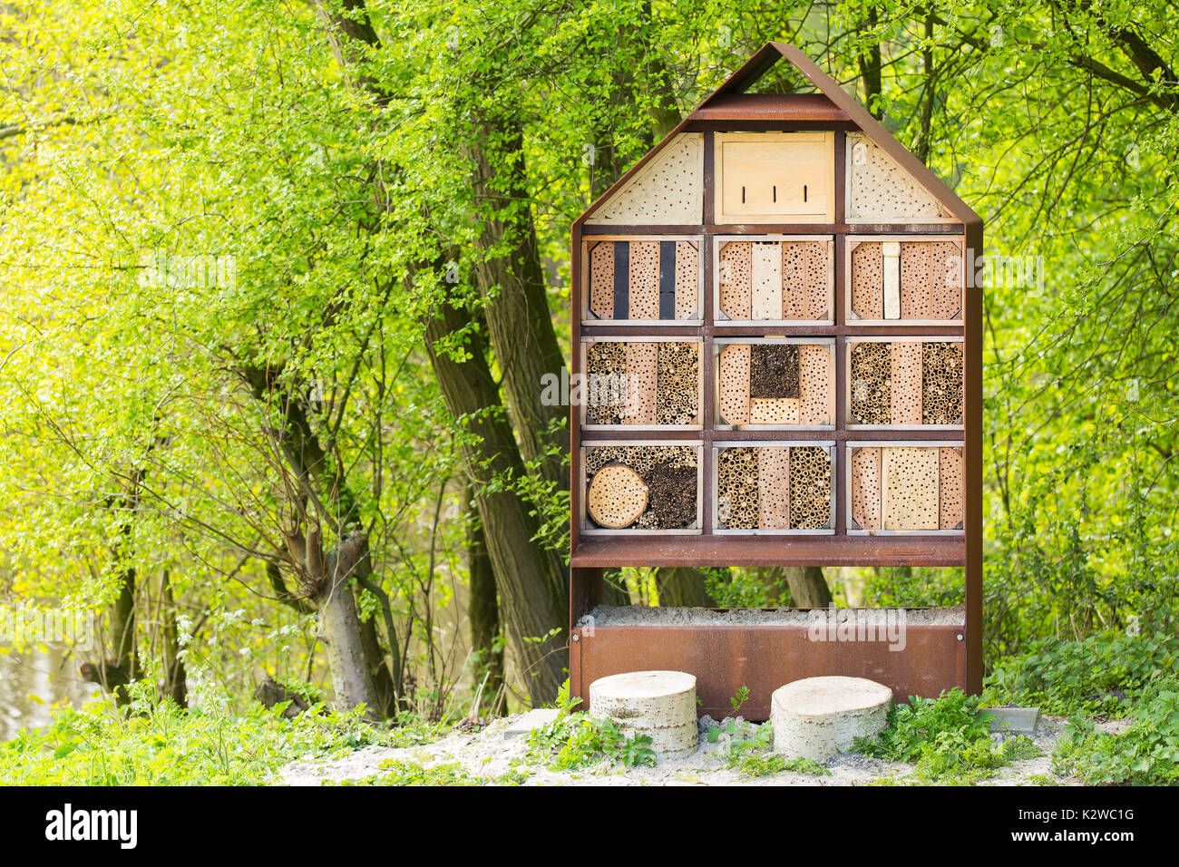 Man-made insect hotel in a green forest. A structure created from ...