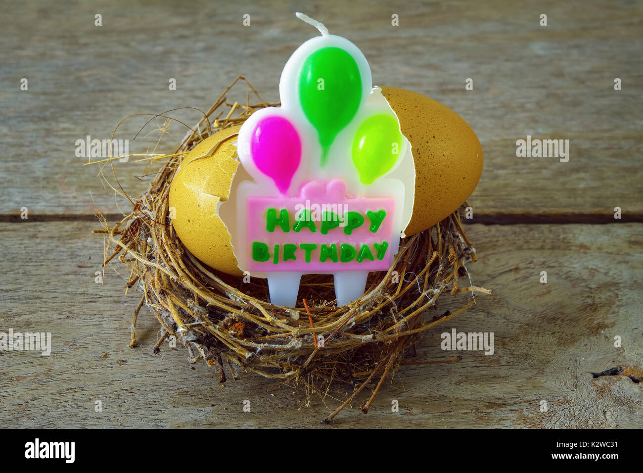 Shattered Eggshell With Nest and Candle for Happy Birthday Concept ...
