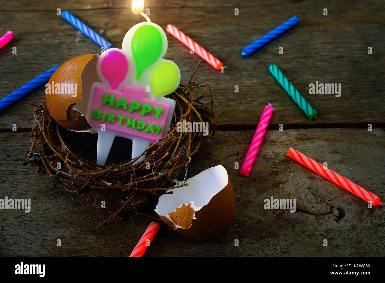 Shattered Eggshell With Nest and Candle for Happy Birthday Concept ...