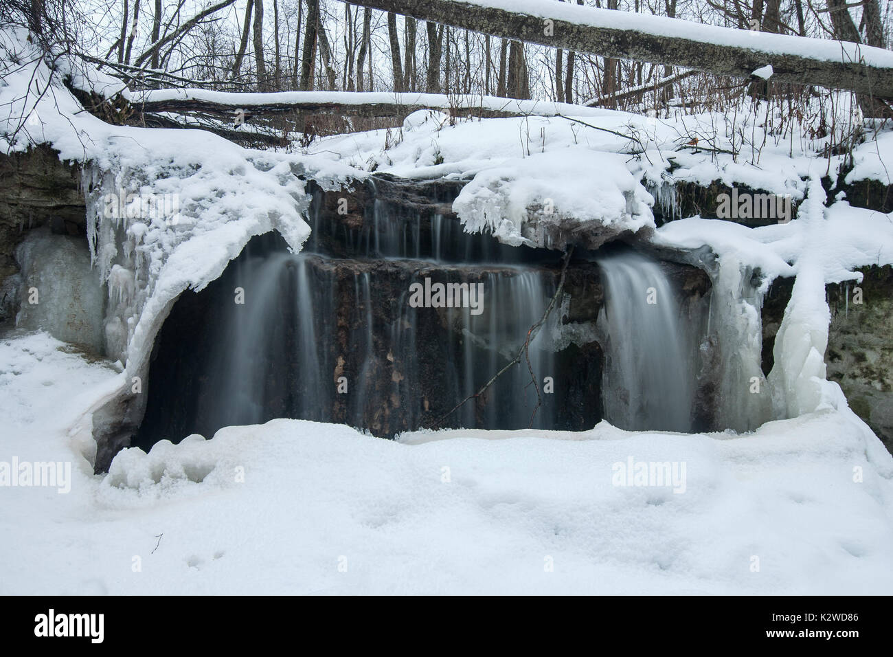 A waterfall in a winter, photographed with a long exposure Stock Photo ...