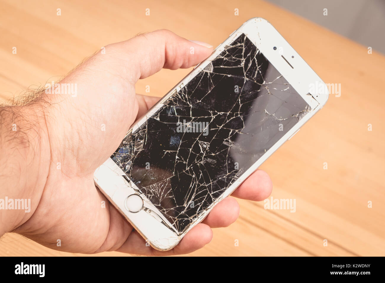 Paris, FRANCE - August 26, 2017: A man holds in his hand an iphone 6S ...